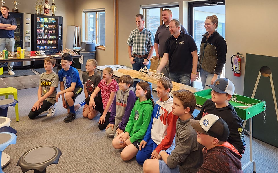 Students Judge Popsicle Stick Bridges Designed by Widseth Employees